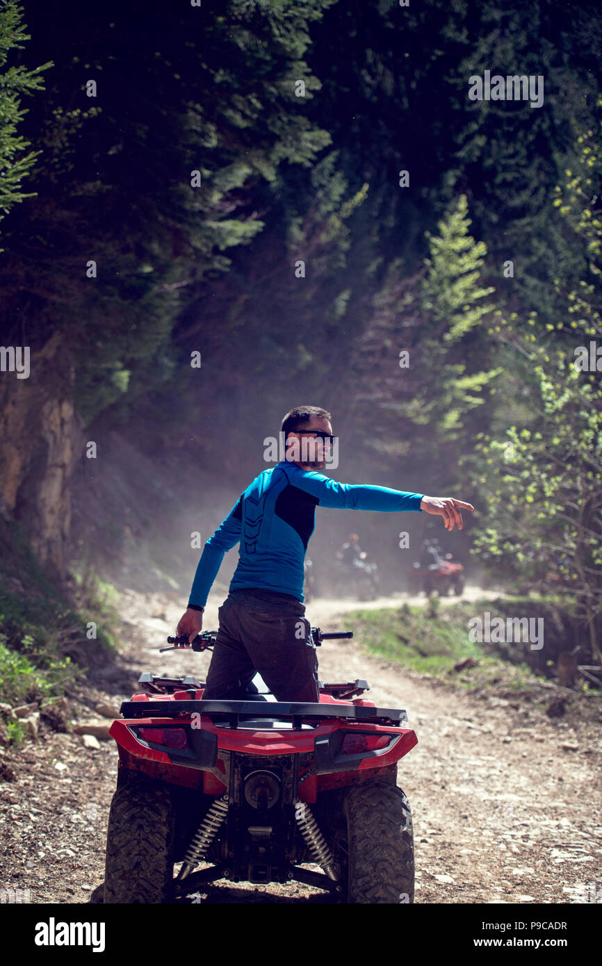 man riding atv vehicle on off road track ,people outdoor sport ...