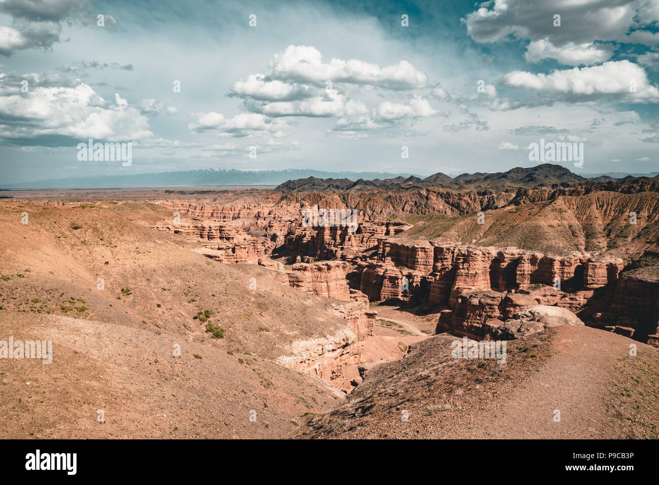 Charyn Grand Canyon with clouds and sun red orange stone Martian ...