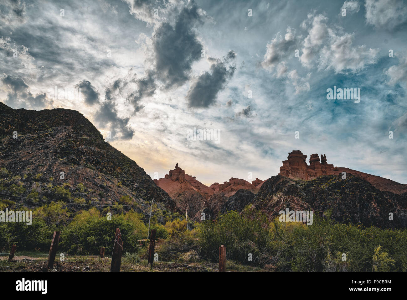 Charyn Grand Canyon with clouds and sun red orange stone Martian ...