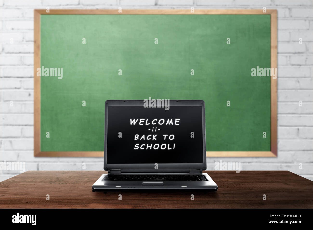 Welcome back to school text on laptop screen on the classroom Stock ...