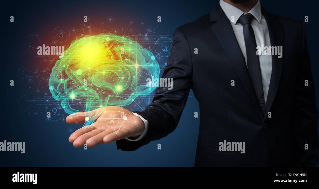 Businessman holding human brain on his hand with logistics symbols ...