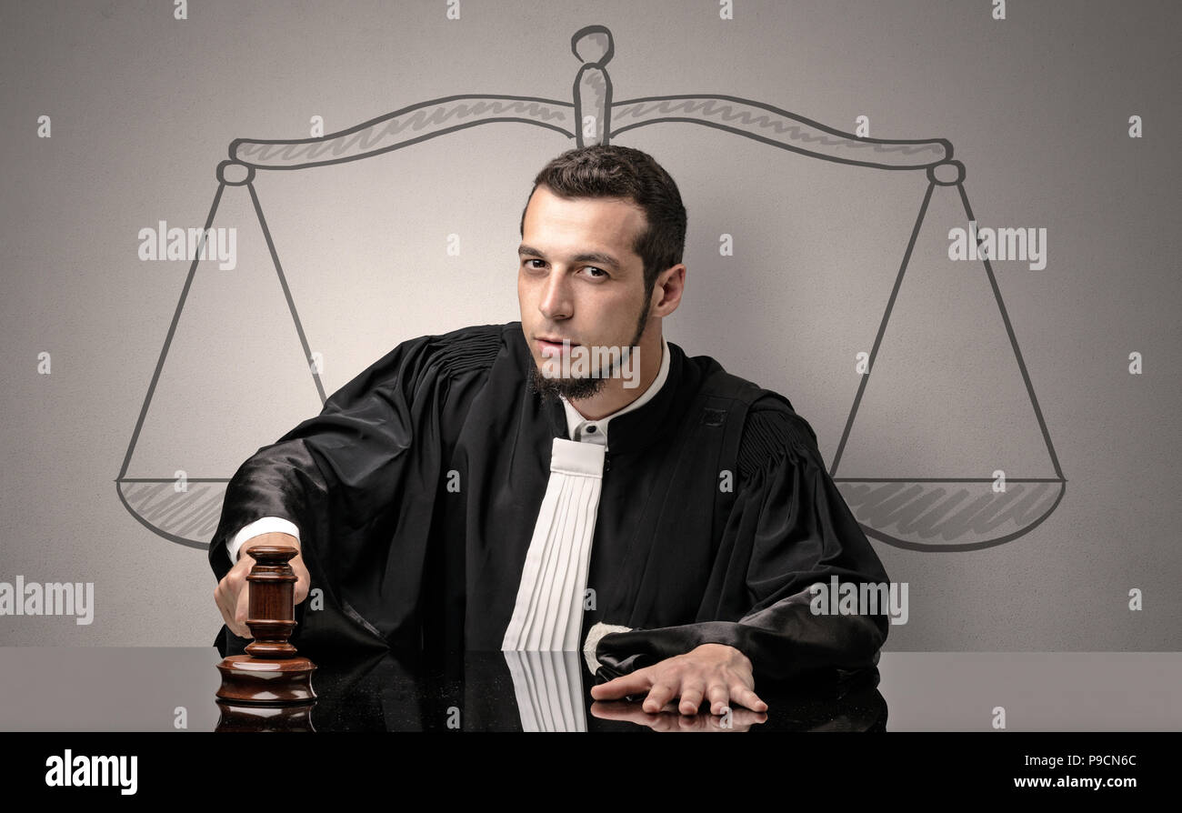 Young handsome judge in black gown making decision Stock Photo - Alamy