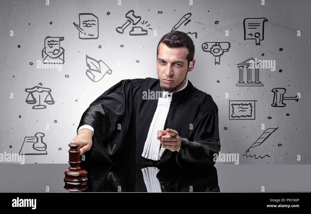 Handsome judge with court symbols around Stock Photo - Alamy