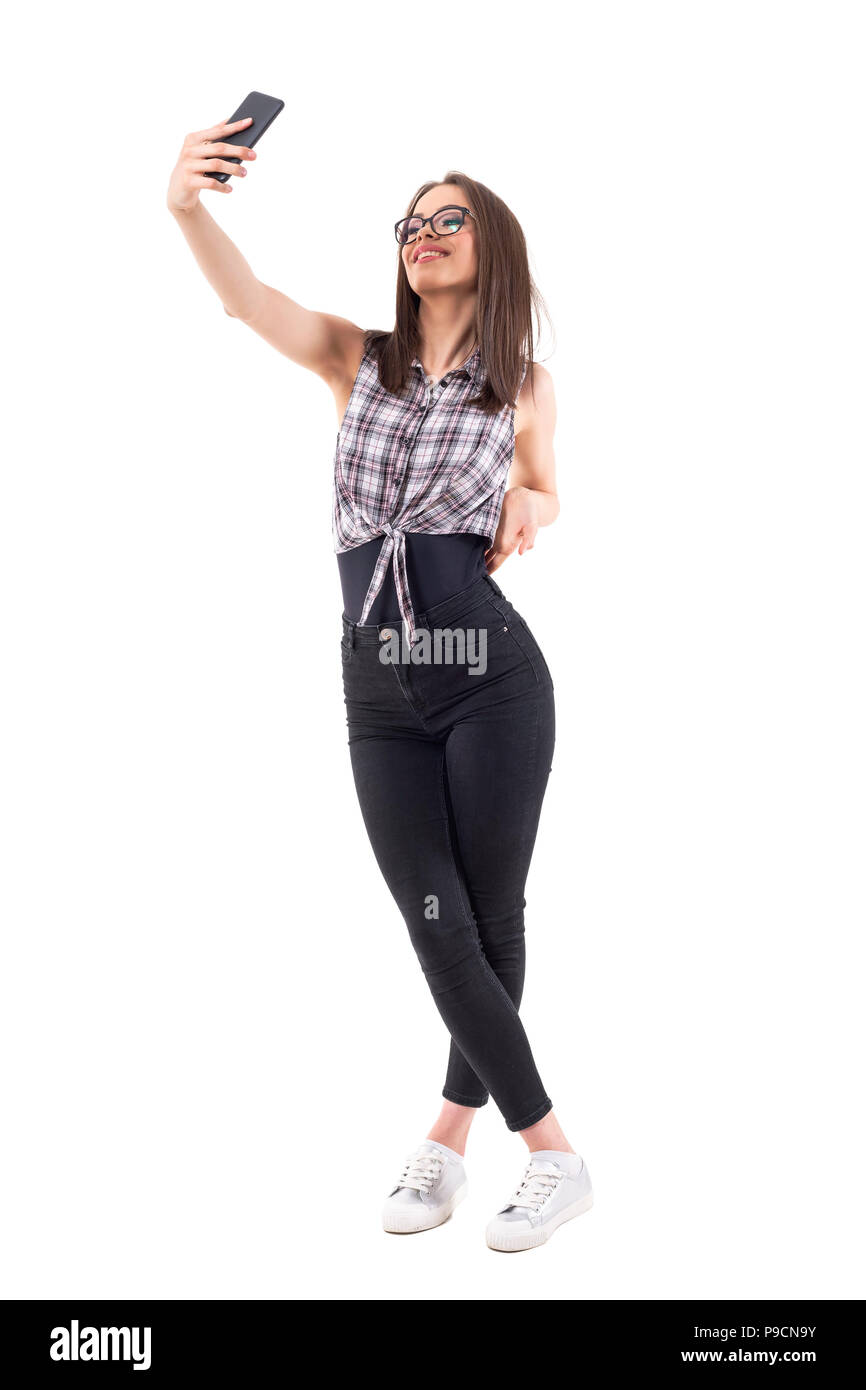 Young hipster style teenage woman taking photo smiling and posing for ...