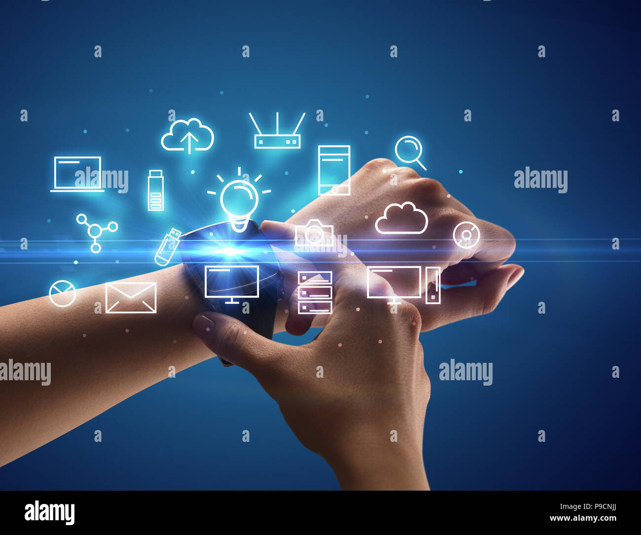 Close up female hand with smartwatch and multimedia symbols around and ...