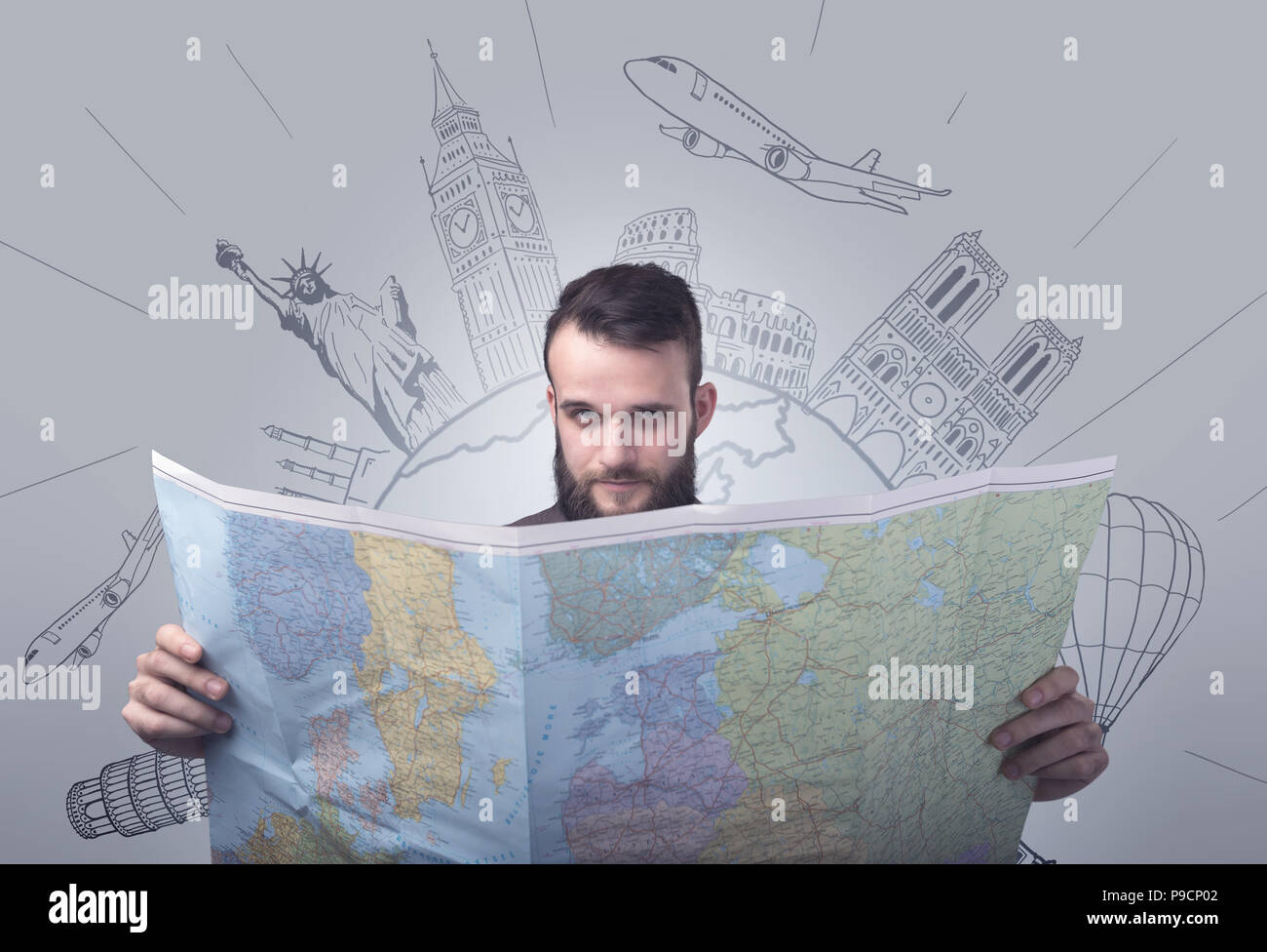 Handsome young man holding a map with famous sightseeing destinations ...
