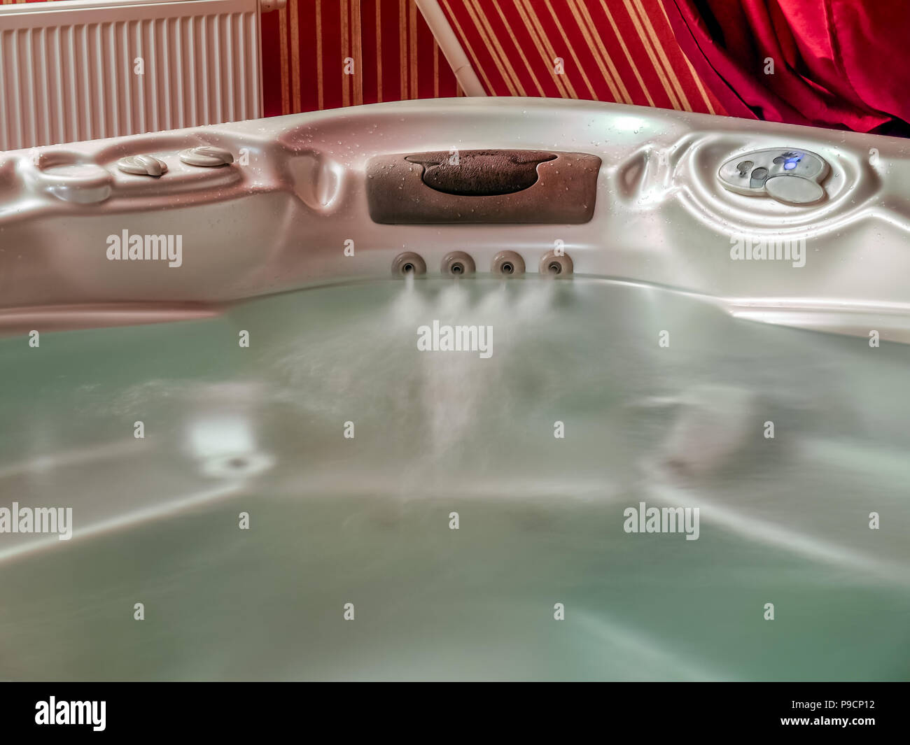 Closeup of jacuzzi filled with water Stock Photo - Alamy