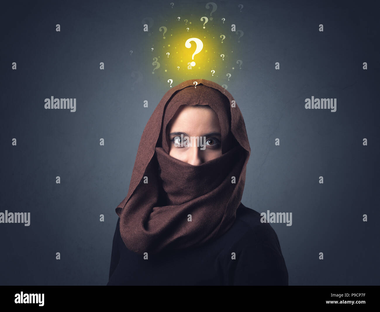 Young muslim woman wearing niqab with yellow question marks above her ...