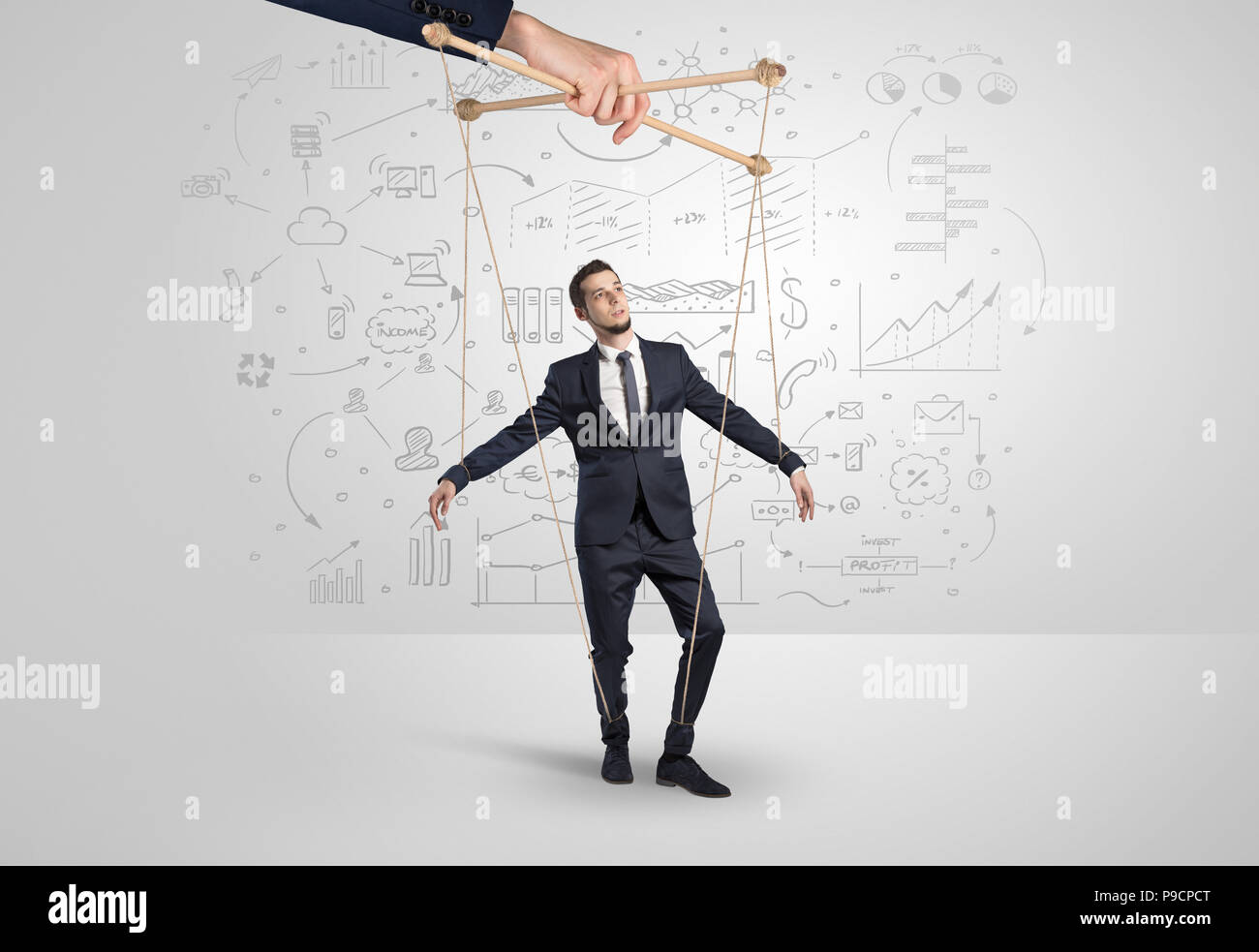 Little businessman controlled from above like a puppet concept Stock ...