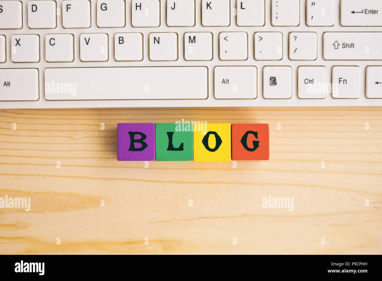 Blog text on wooden block with computer keyboard on wooden desk Stock ...