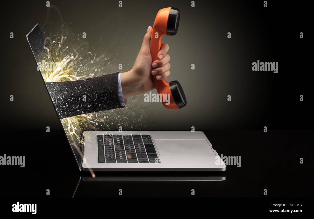 Hand with phone coming out of a laptop with sparkling effects Stock ...