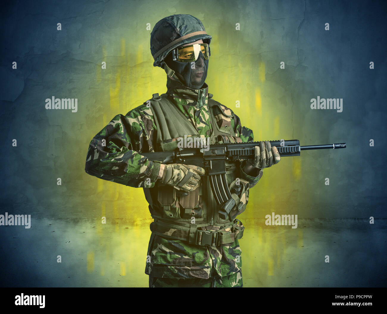 Hazard, menace soldier in a ruined crumbly building with arms on his ...