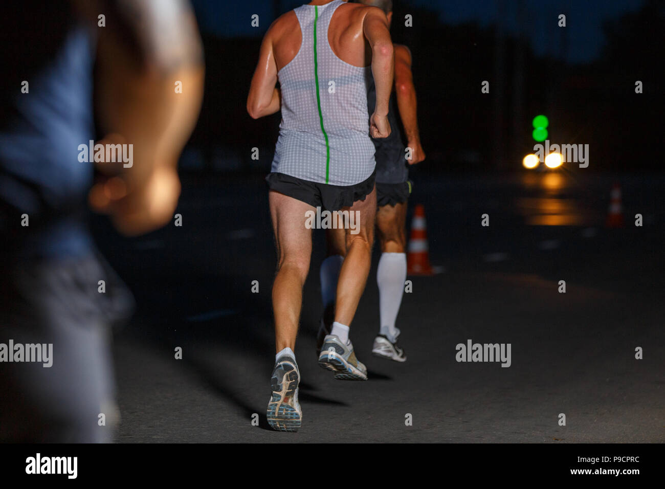 Street night people run hi-res stock photography and images - Alamy