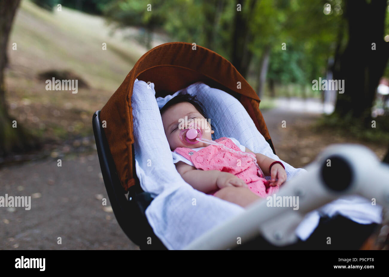 Little girl sleeping in park hi-res stock photography and images - Alamy