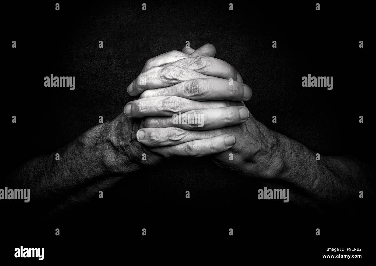 Man's Hands with crossed fingers. This is a classical gesture of a ...
