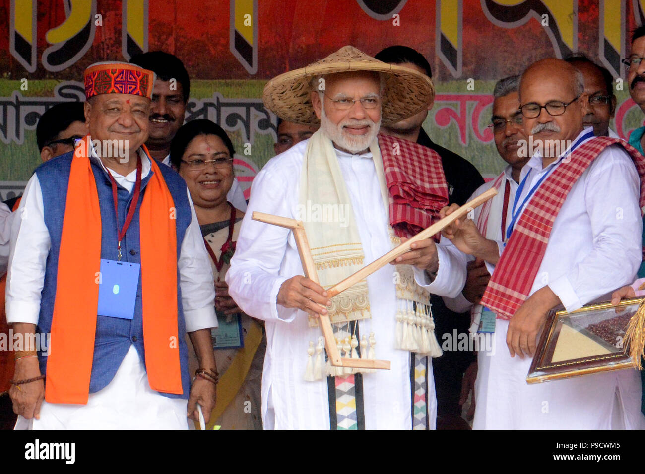Prime Minister Narendra Modi (middle) addresses a farmer rally in ...