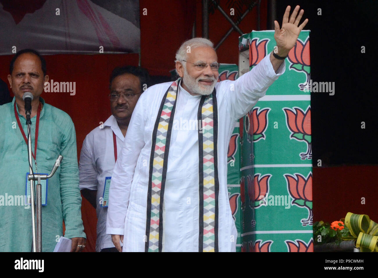 Prime Minister Narendra Modi greets BJP activist during farmer rally ...