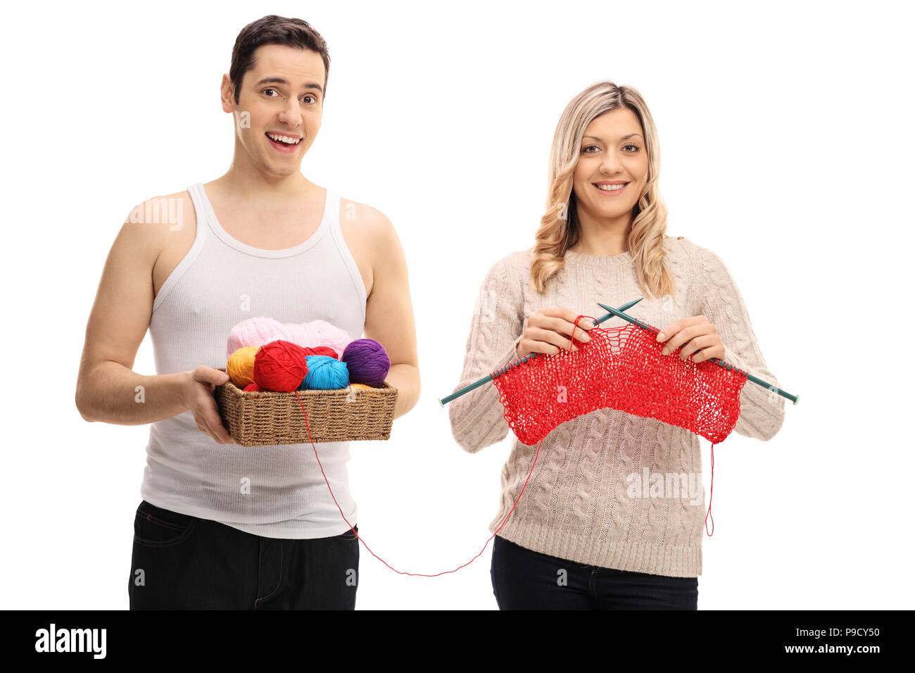 Young man and a young woman knitting together isolated on white ...