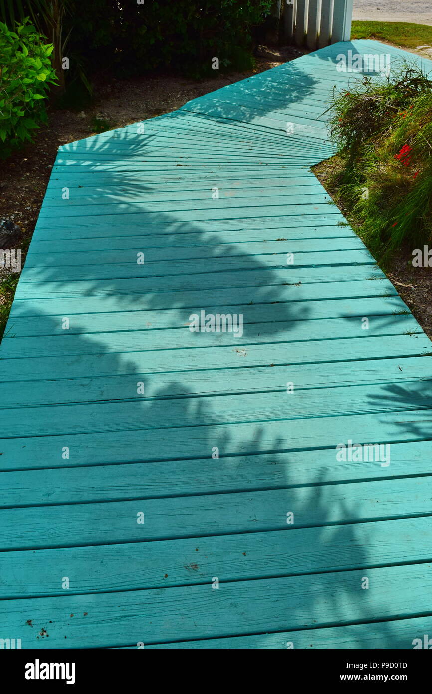 Turquoise blue boardwalk through outdoor landscape, Marsh Harbor, Abaco ...