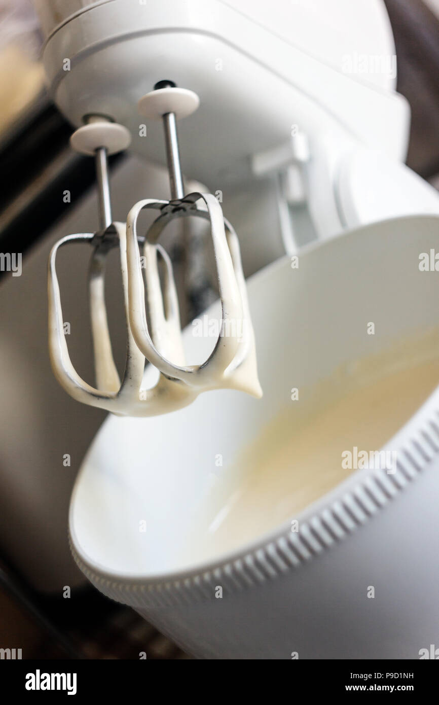 Making of a cream for home-made cakes on a mixer Stock Photo - Alamy