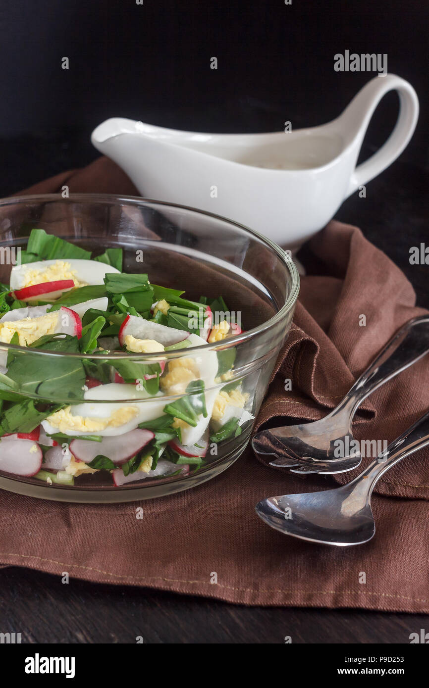 Vegetable vegan salad of ramson, radish, green onions and boiled eggs ...