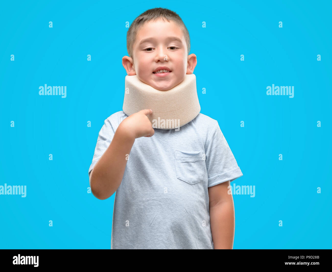 Dark haired little child injured wearing neck collar very happy ...