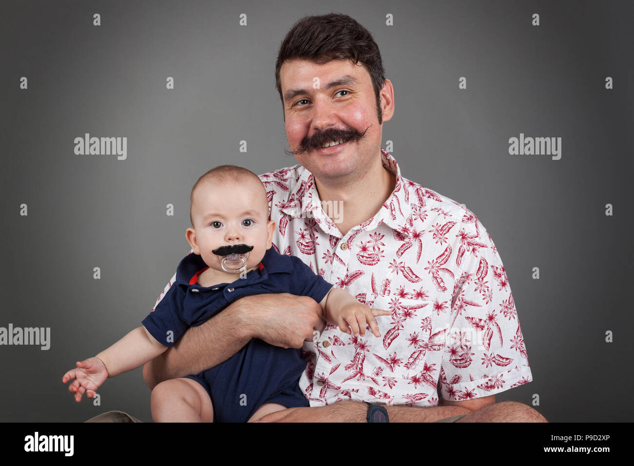 Handlebar Mustache Family-Father and son lookalike, isolated on grey ...