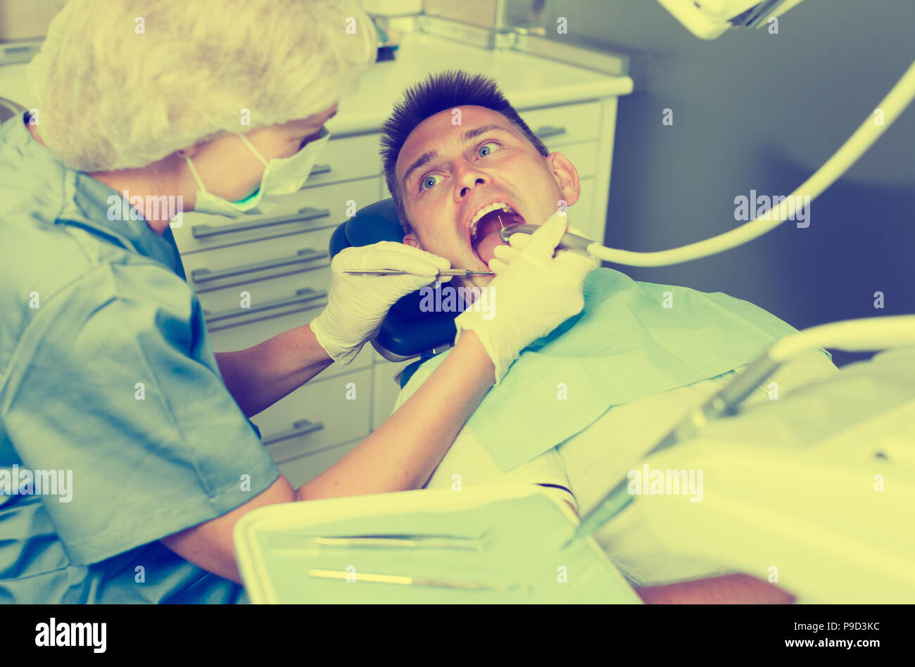 Young man visiting dentist, taking care of his health and dental ...