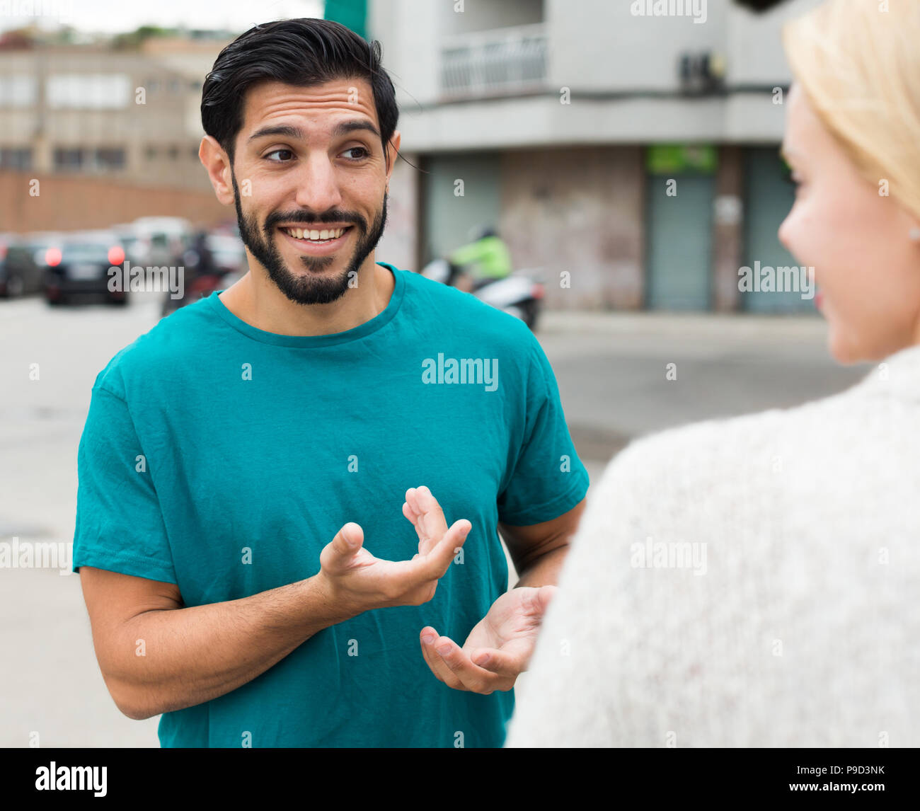 Latino couple talking street hi-res stock photography and images - Alamy