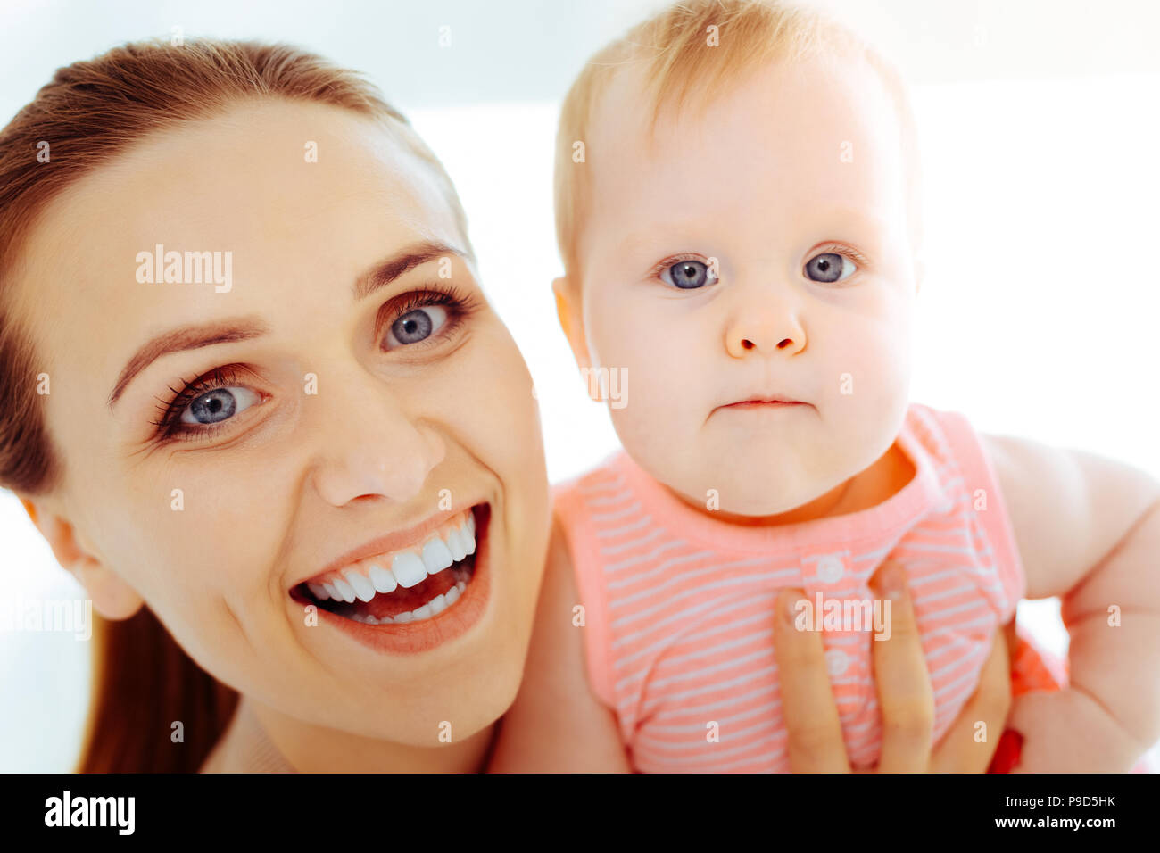 Serious baby girl looking forward Stock Photo - Alamy