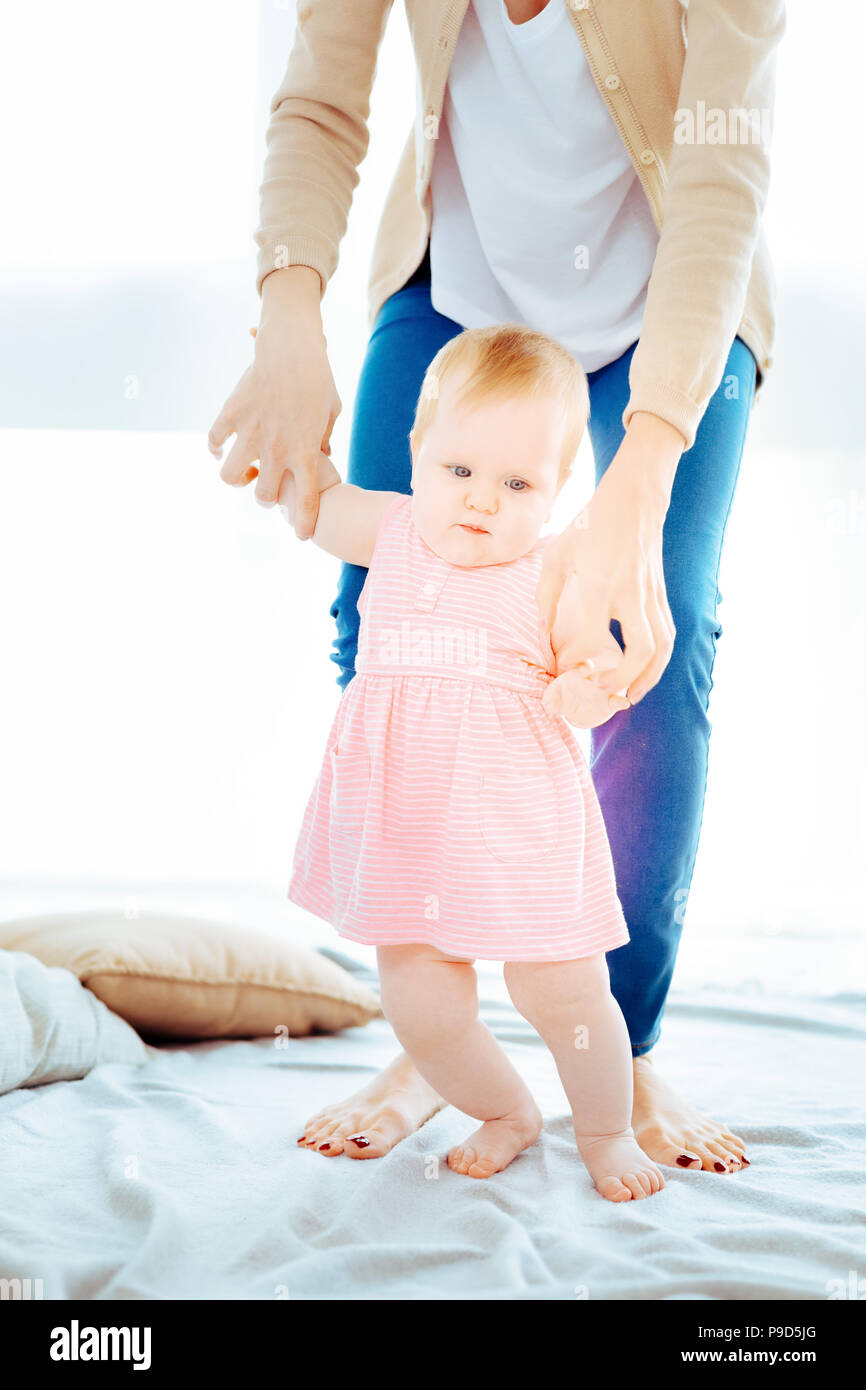 Concentrated girl trying to do steps Stock Photo - Alamy