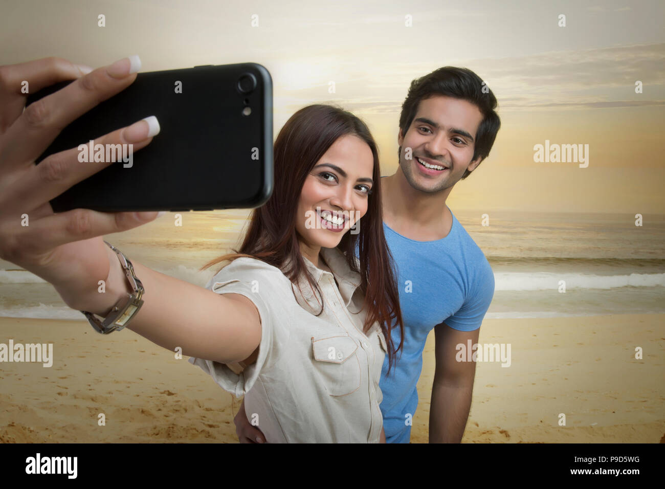 Two women taking selfie on beach hi-res stock photography and images ...