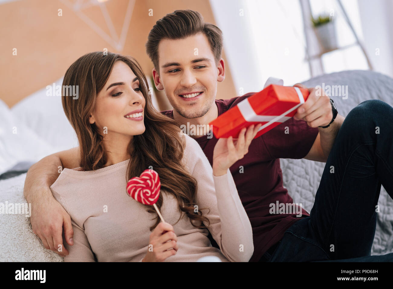 Attractive female person taking present Stock Photo - Alamy