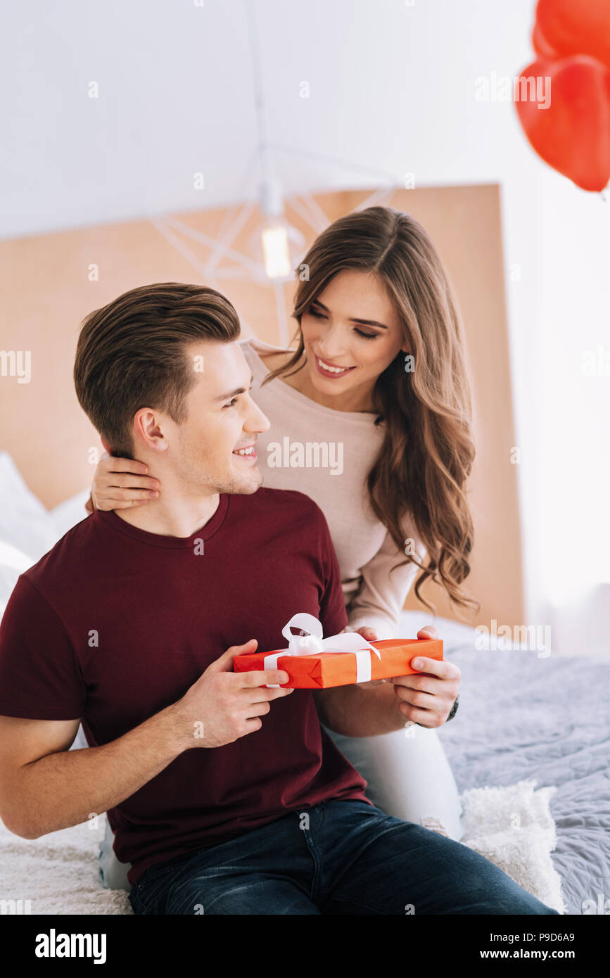 Amazing girl congratulating her boyfriend Stock Photo - Alamy