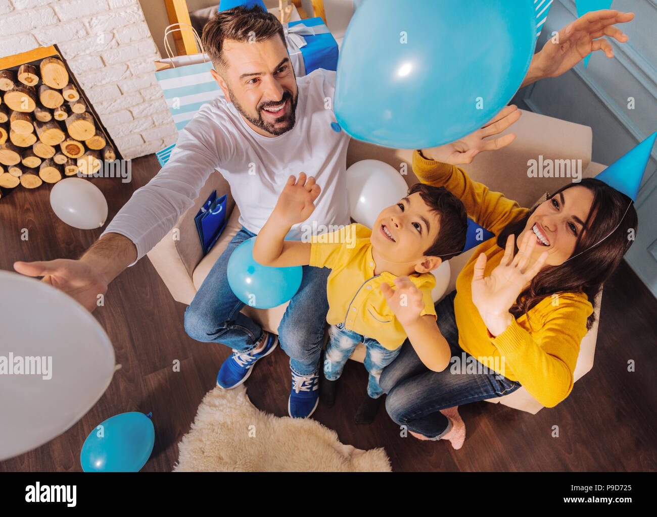 Party family playing balloons hi-res stock photography and images - Alamy