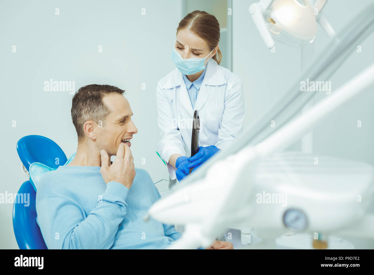 Positive delighted man being satisfied Stock Photo - Alamy