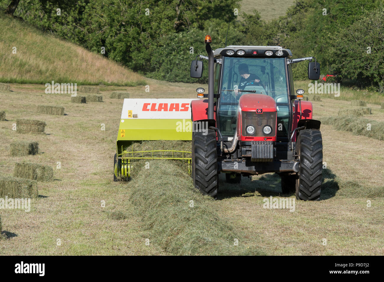 Tractor cutting hay field summer hi-res stock photography and images ...