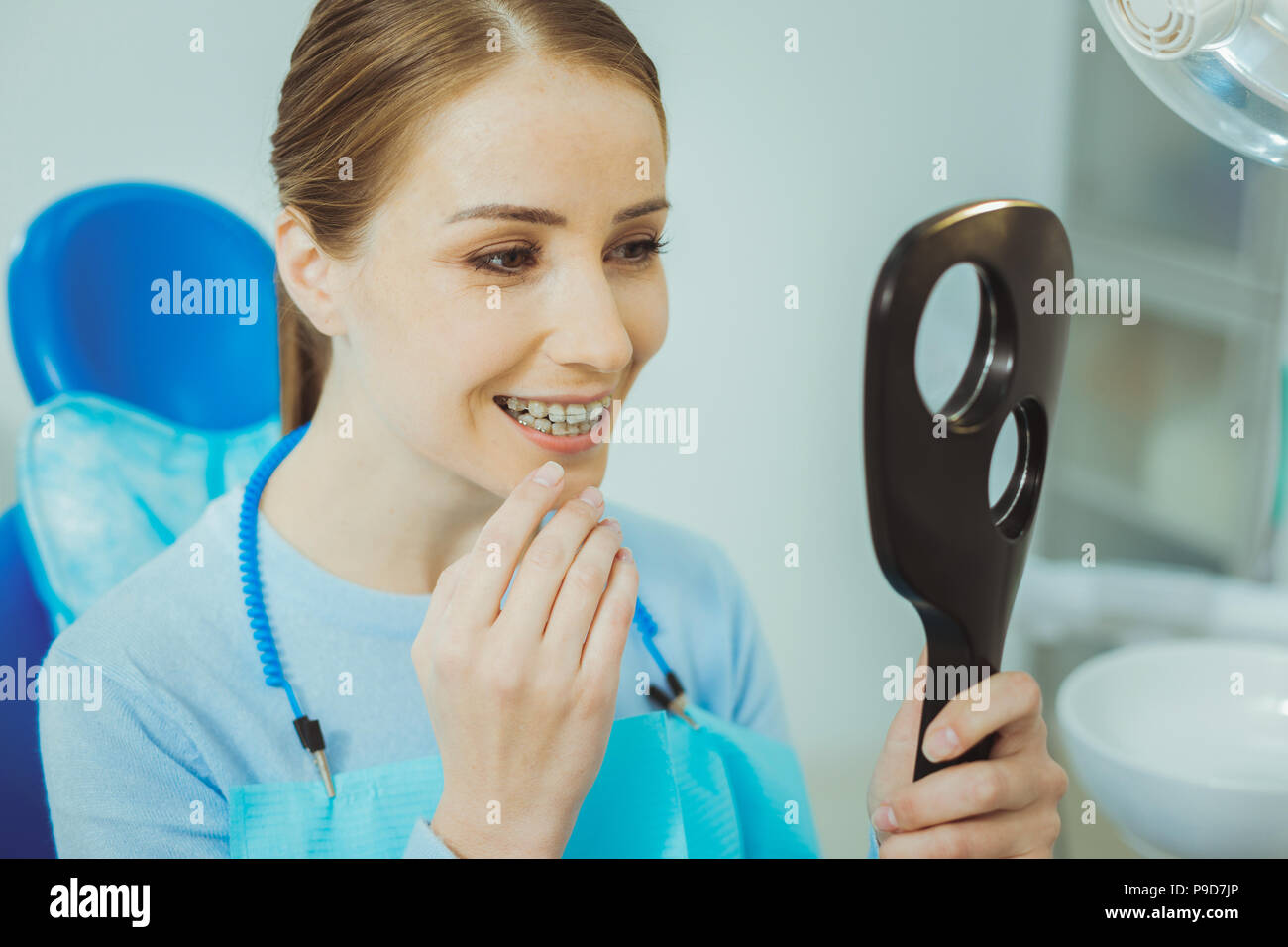 Female dentist checking patient girl hi-res stock photography and ...