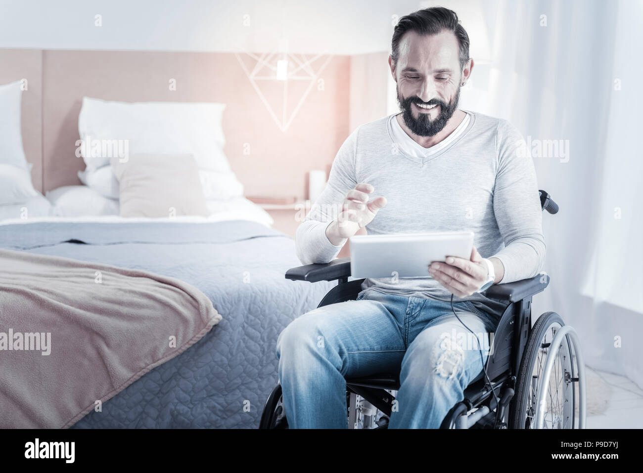 Handsome male person having video conversation Stock Photo - Alamy