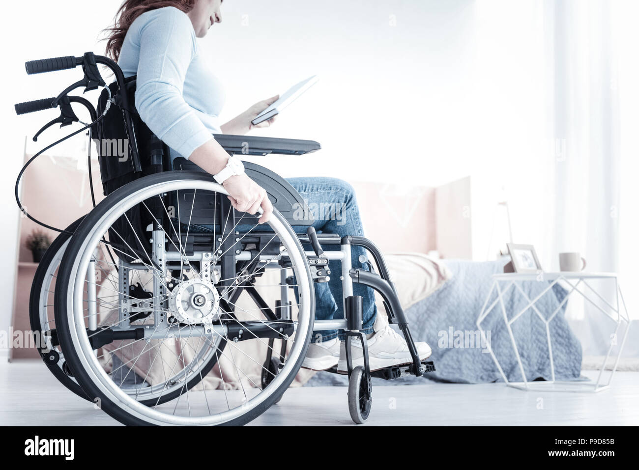 Delighted female person sitting in semi position Stock Photo - Alamy