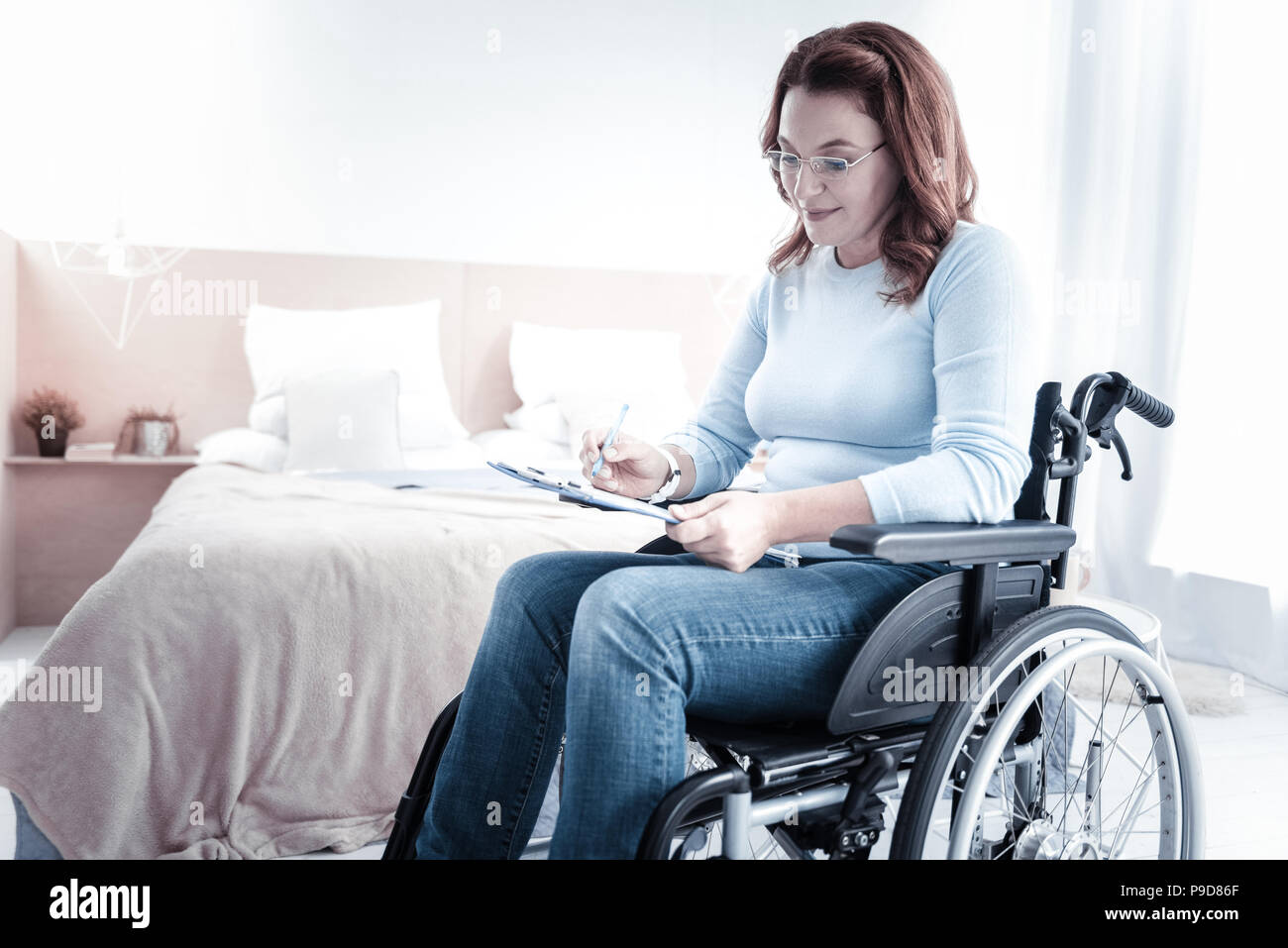 Concentrated female person working at project Stock Photo - Alamy