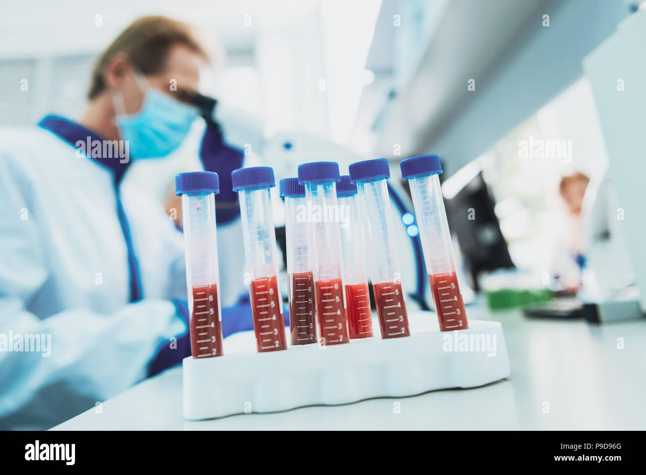 Close up of test tubes that standing on support Stock Photo - Alamy