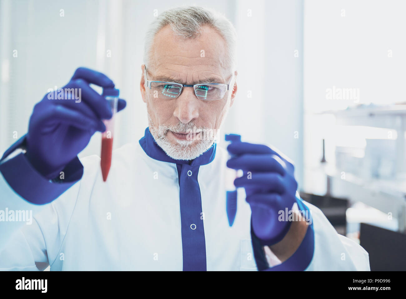 Serious scientist staring at biological product Stock Photo - Alamy