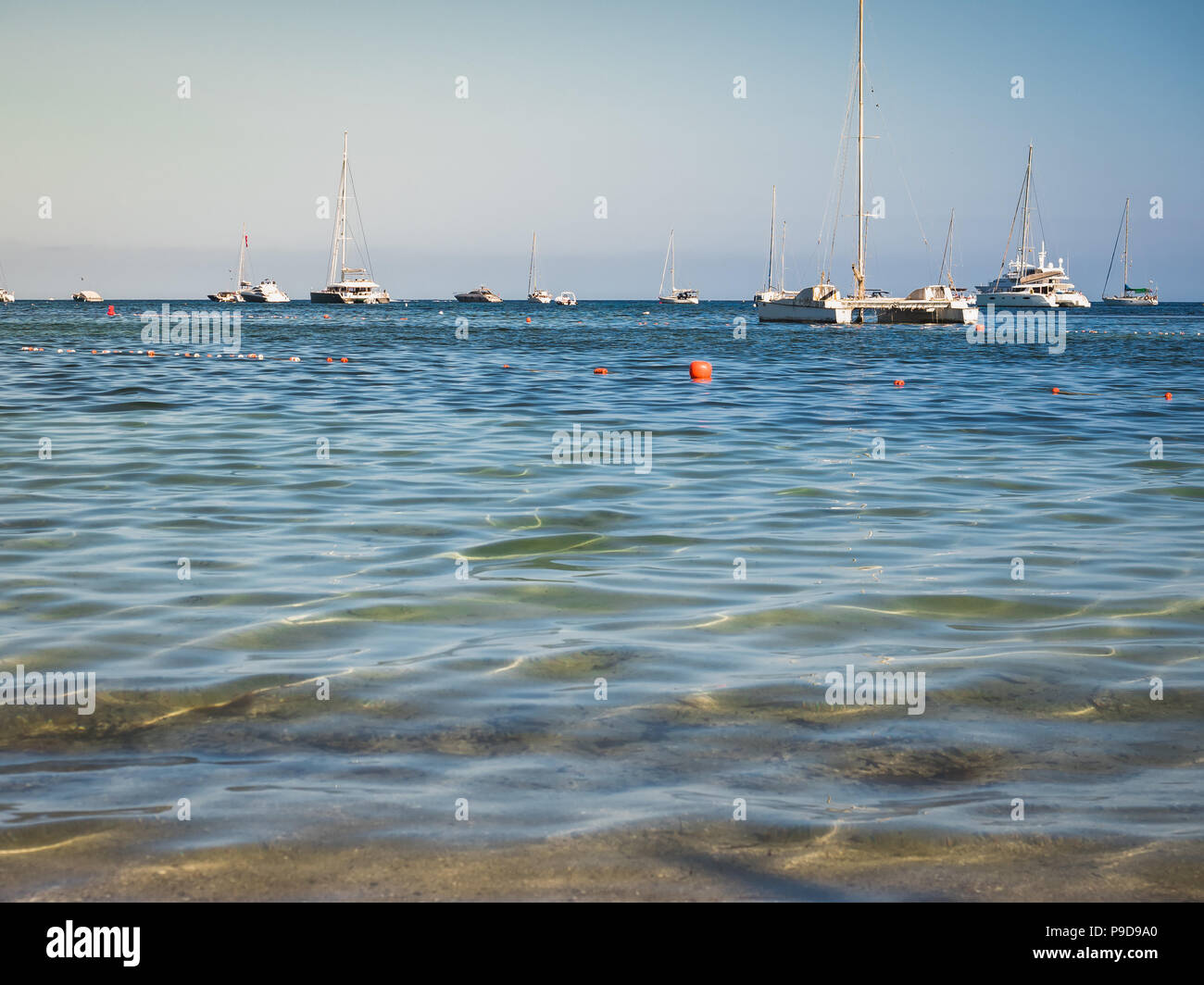 Seascape. Ship on the background of a coastline and a clear blue sky ...