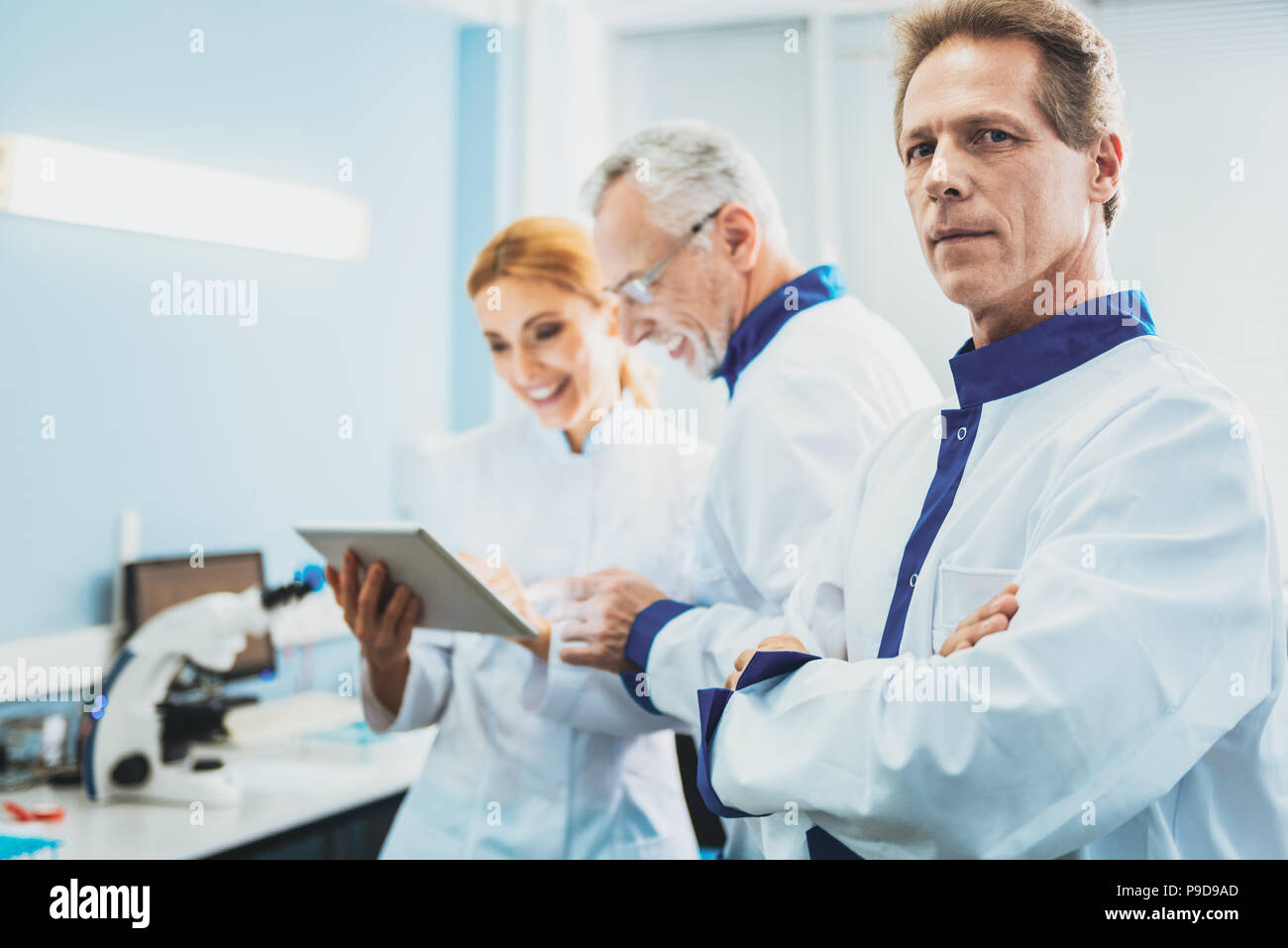 Professional serious scientist standing hi-res stock photography and ...