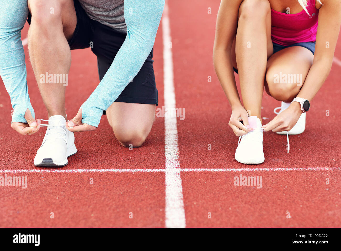 Picture showing man and woman racing on outdoor track Stock Photo - Alamy