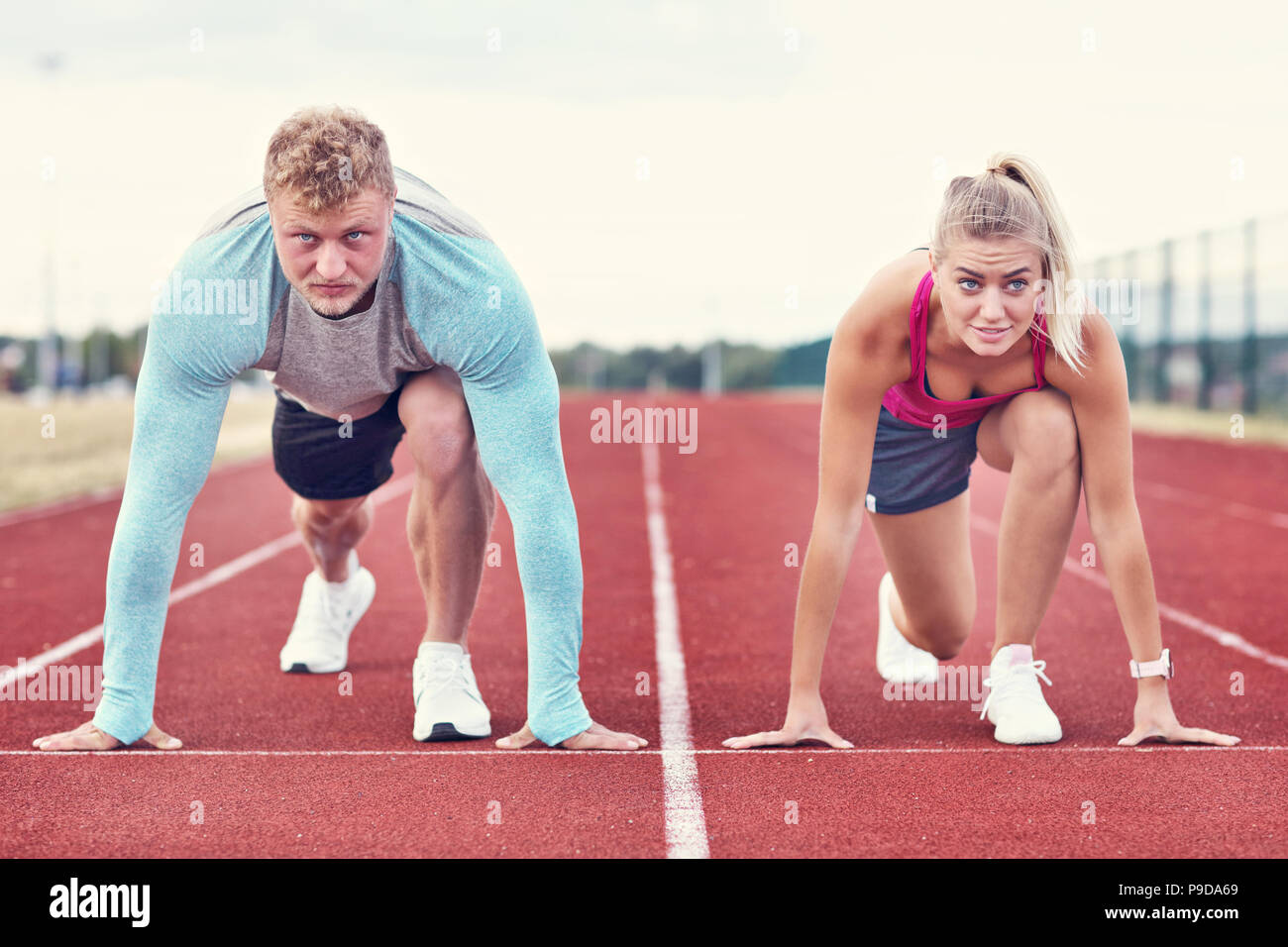 Picture showing man and woman racing on outdoor track Stock Photo - Alamy