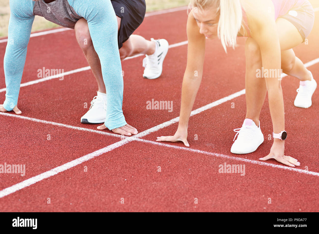 Picture showing man and woman racing on outdoor track Stock Photo - Alamy