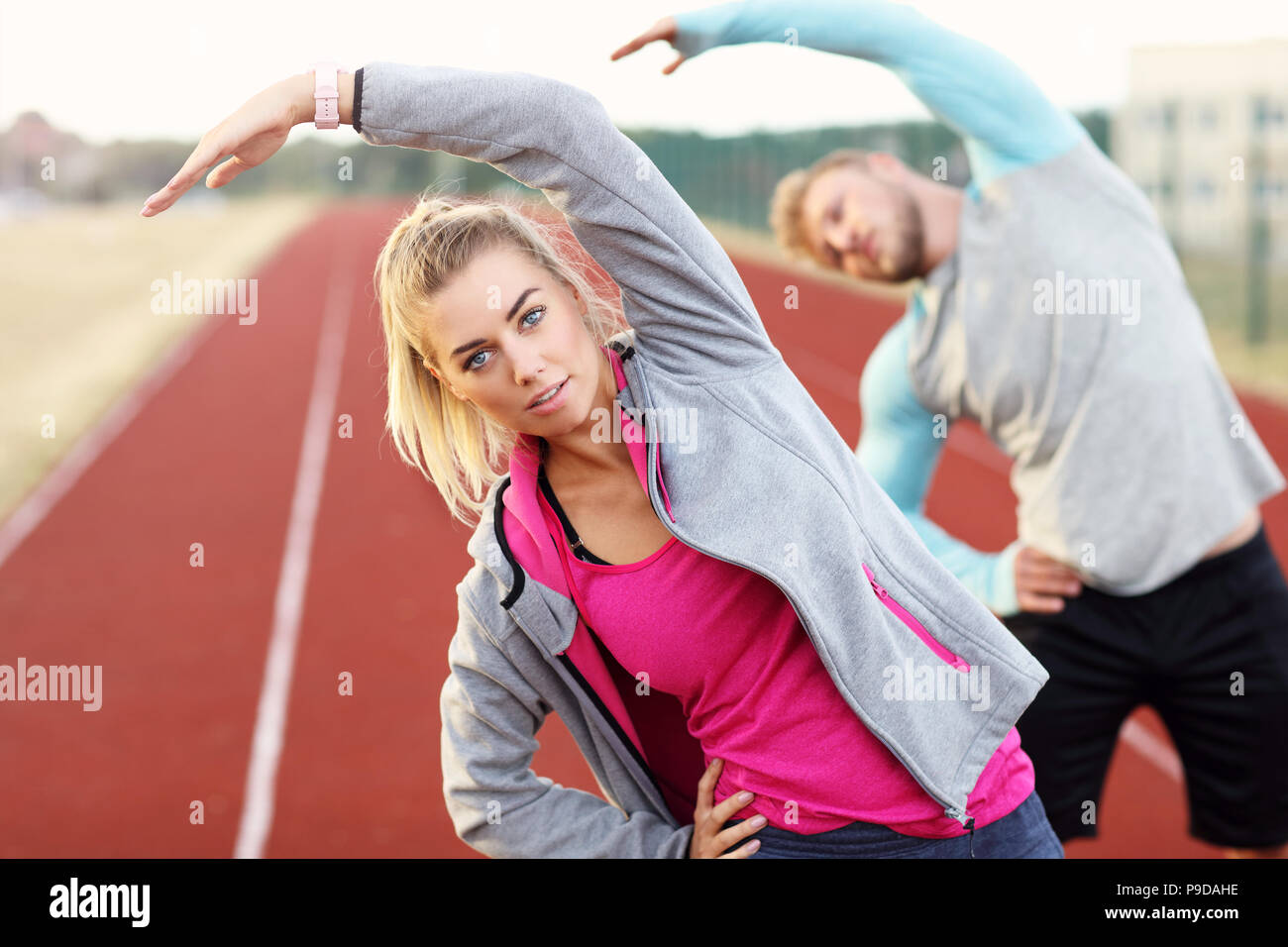 Picture showing man and woman racing on outdoor track Stock Photo - Alamy