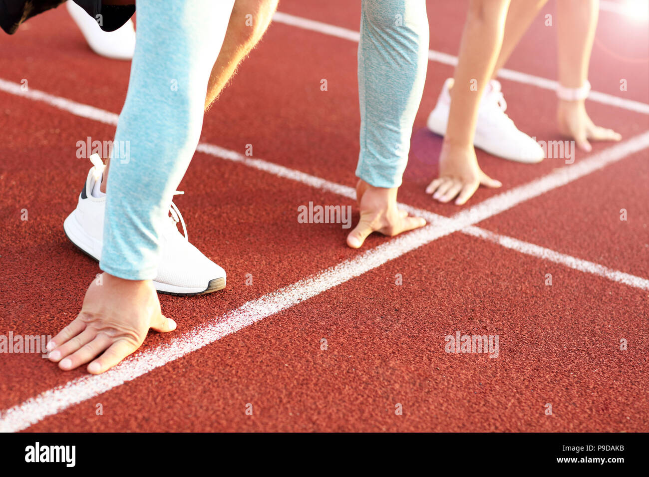 Picture showing man and woman racing on outdoor track Stock Photo - Alamy